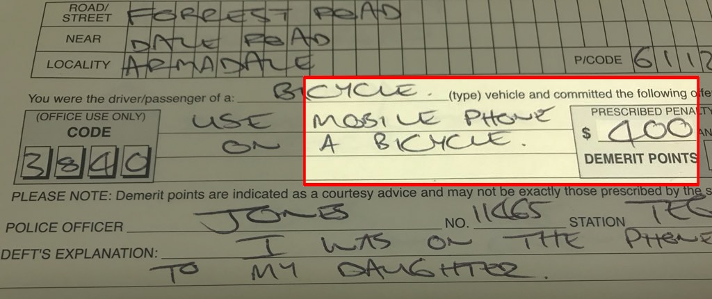 Cyclist hit with $400 fine for talking on mobile phone while riding ...