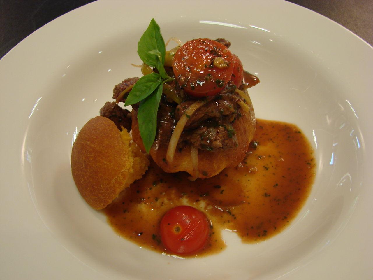 Sauted beef with tomatoes and leek, served in tomato and basil brioche ...