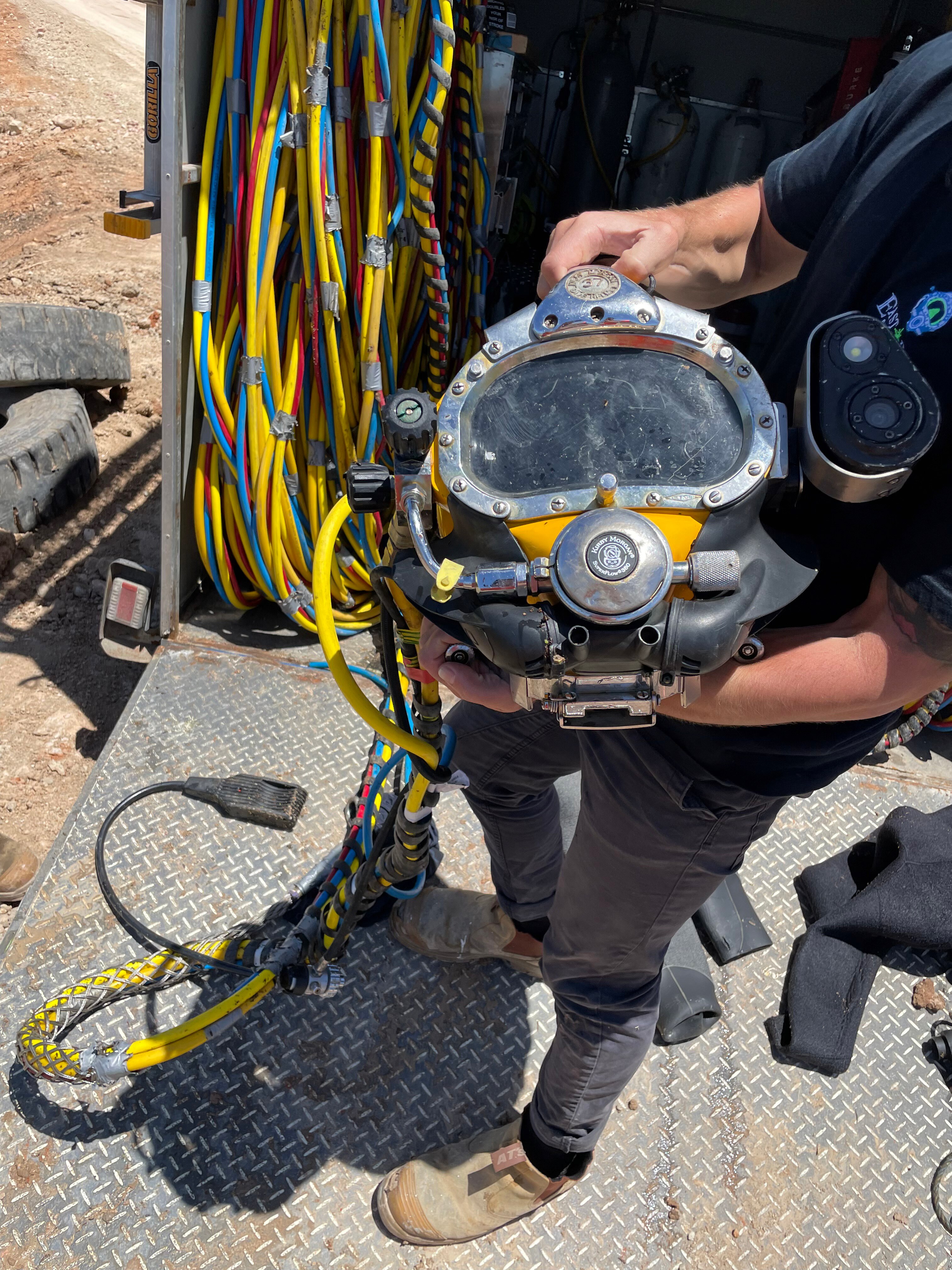 Divers securing submerged stormwater outlets to prevent backflow in SA ...