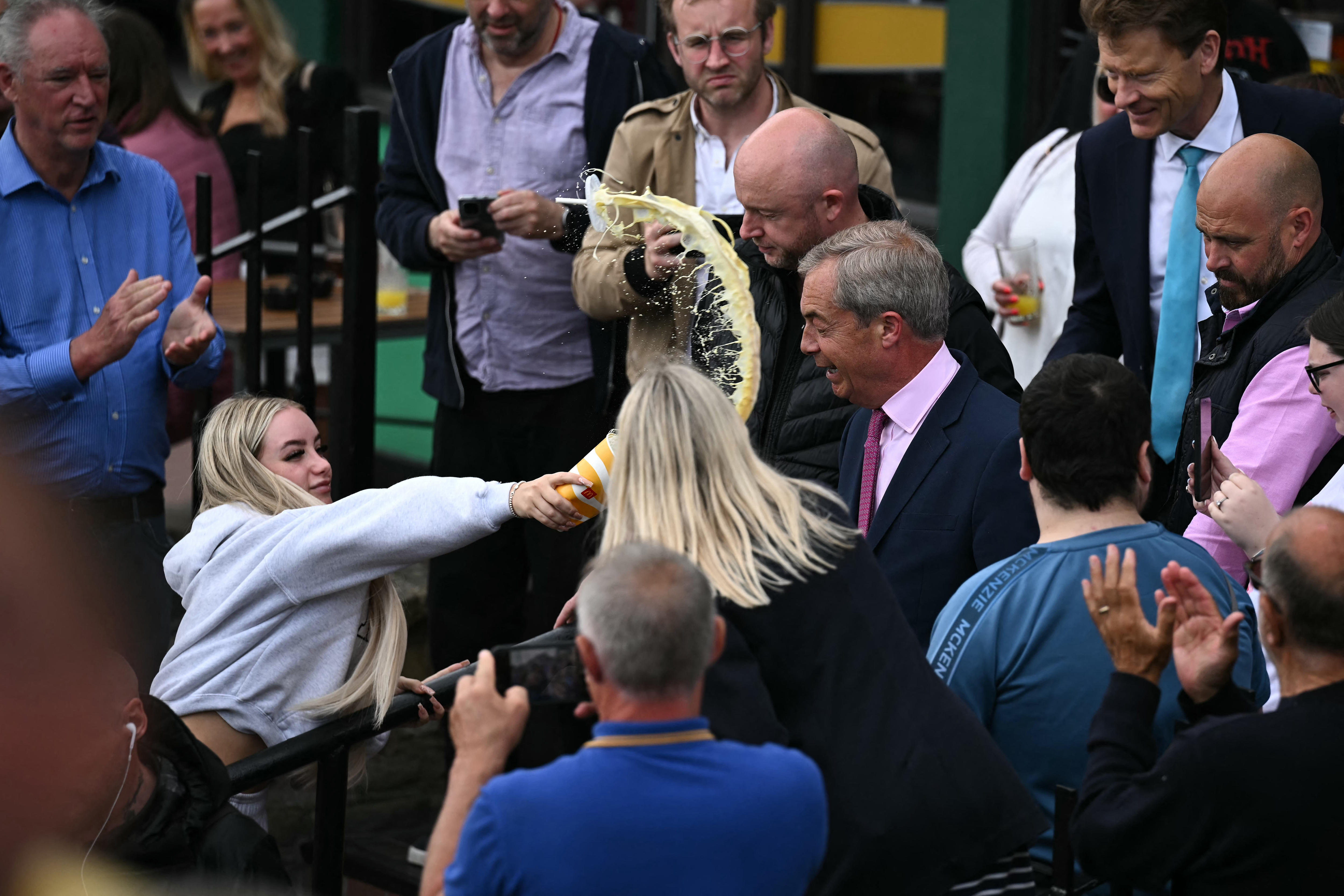 Woman who threw milkshake at Nigel Farage handed jail sentence – Robert