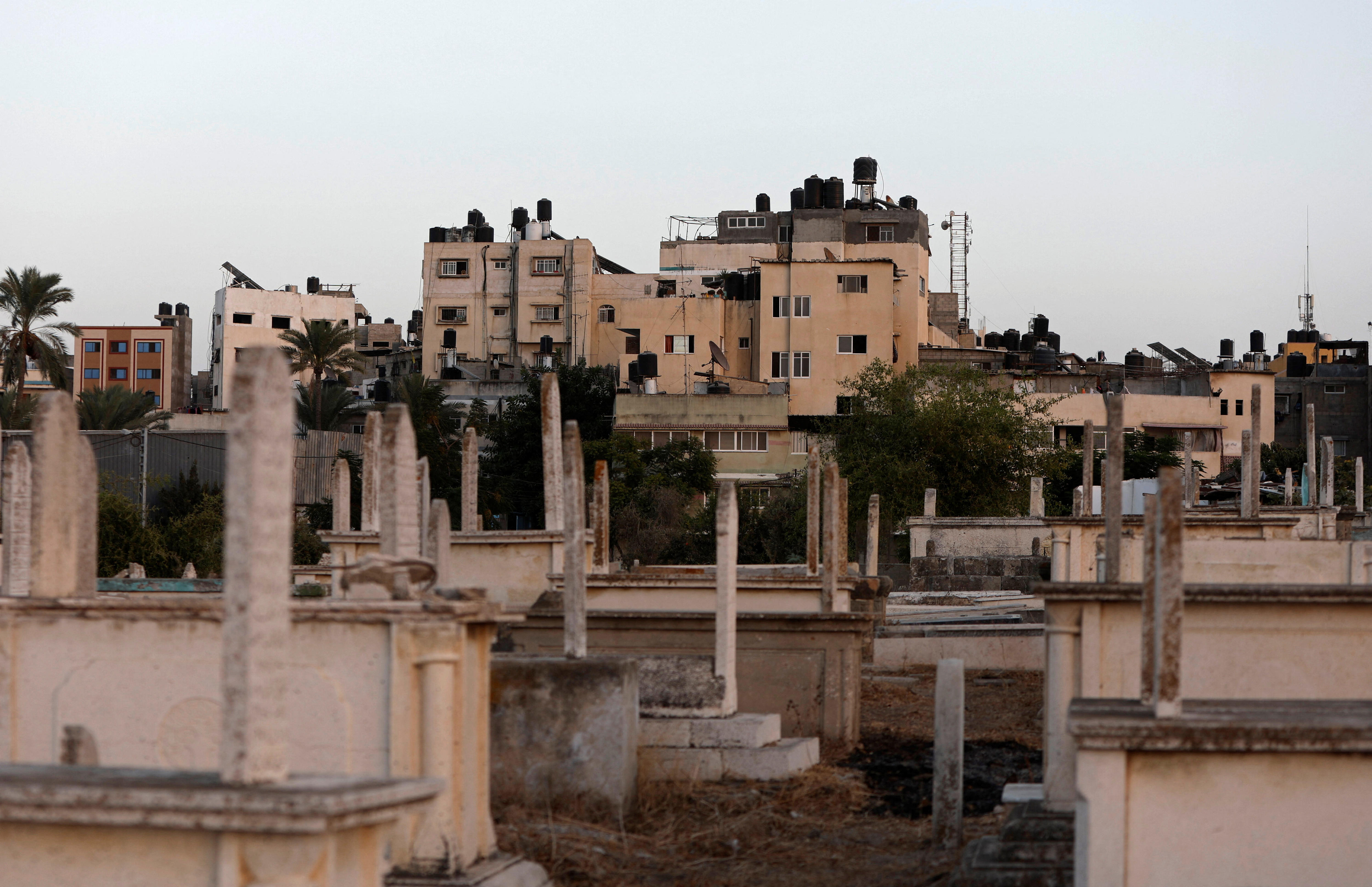 Authorities say cemeteries are full as families build homes among ...