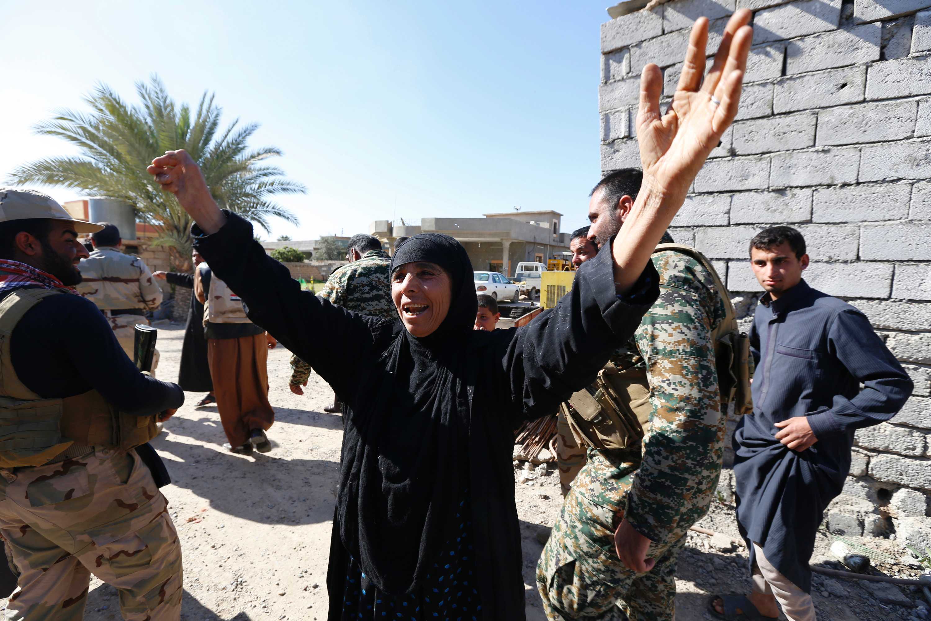 Islamic State: Iraqi troops, militia greeted with celebrations after ...