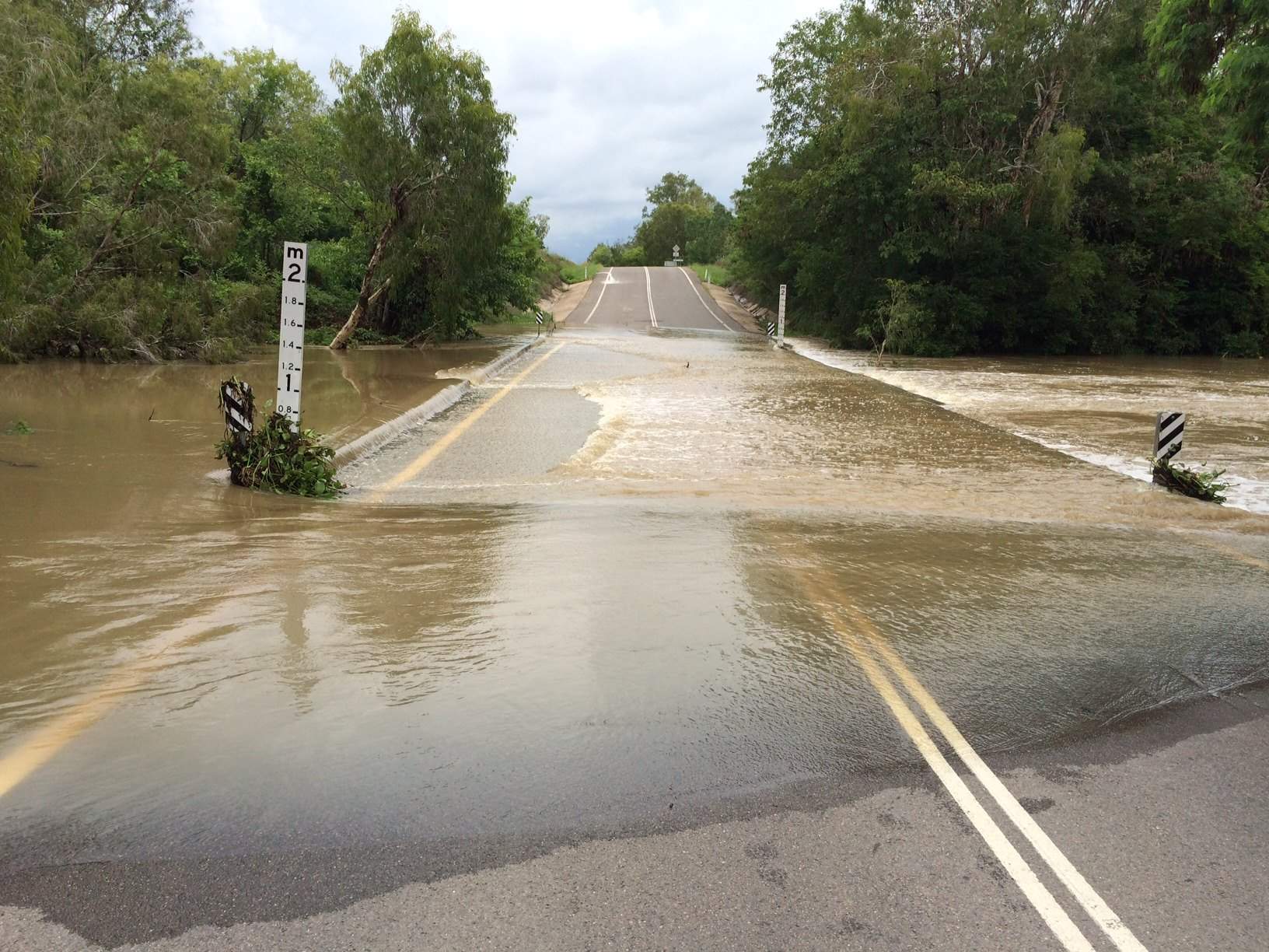 Dramatic rescue from floodwater as heavy rain closes major roads in ...