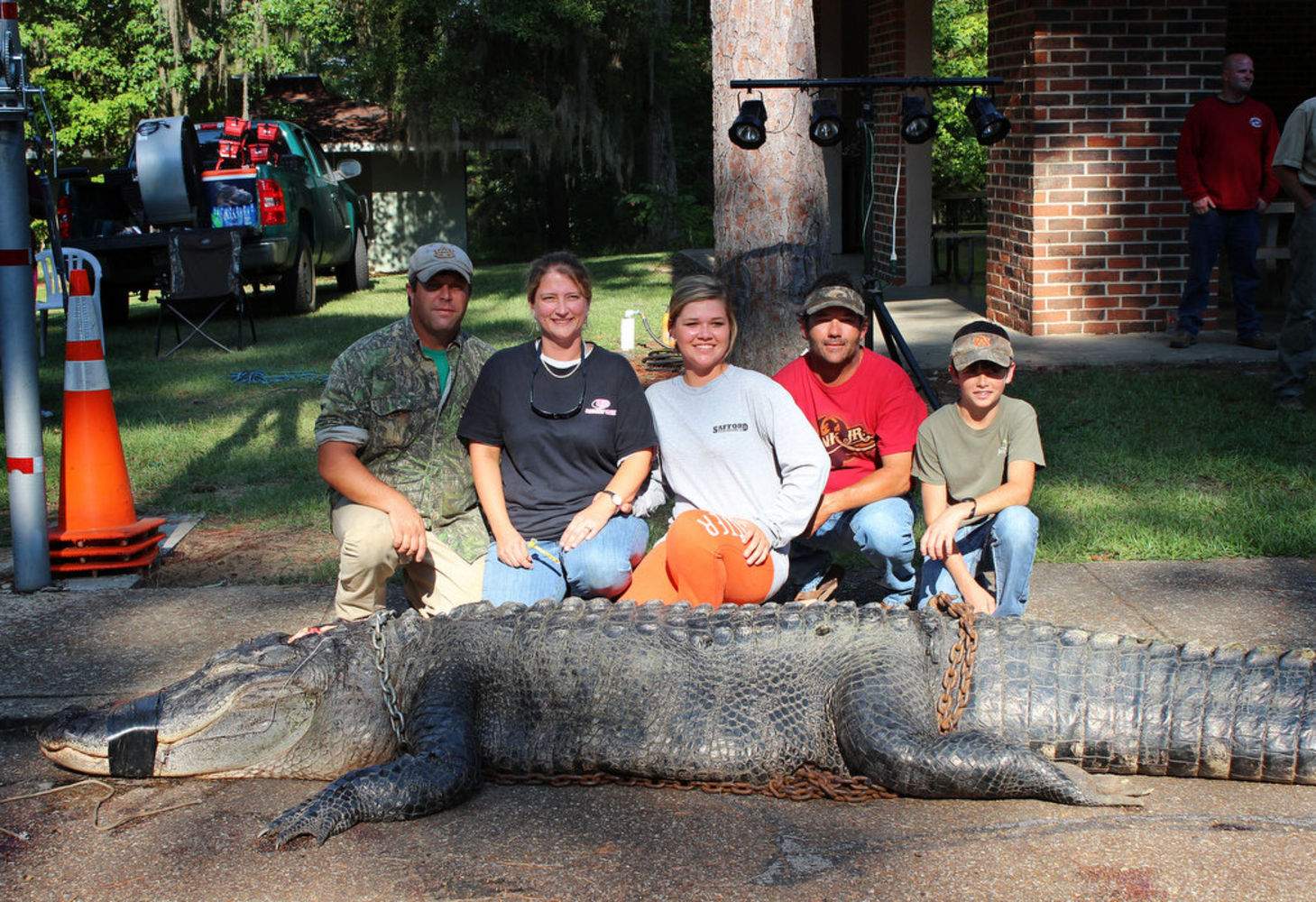 Alligator weighs in at record 459kg after being caught by family in ...