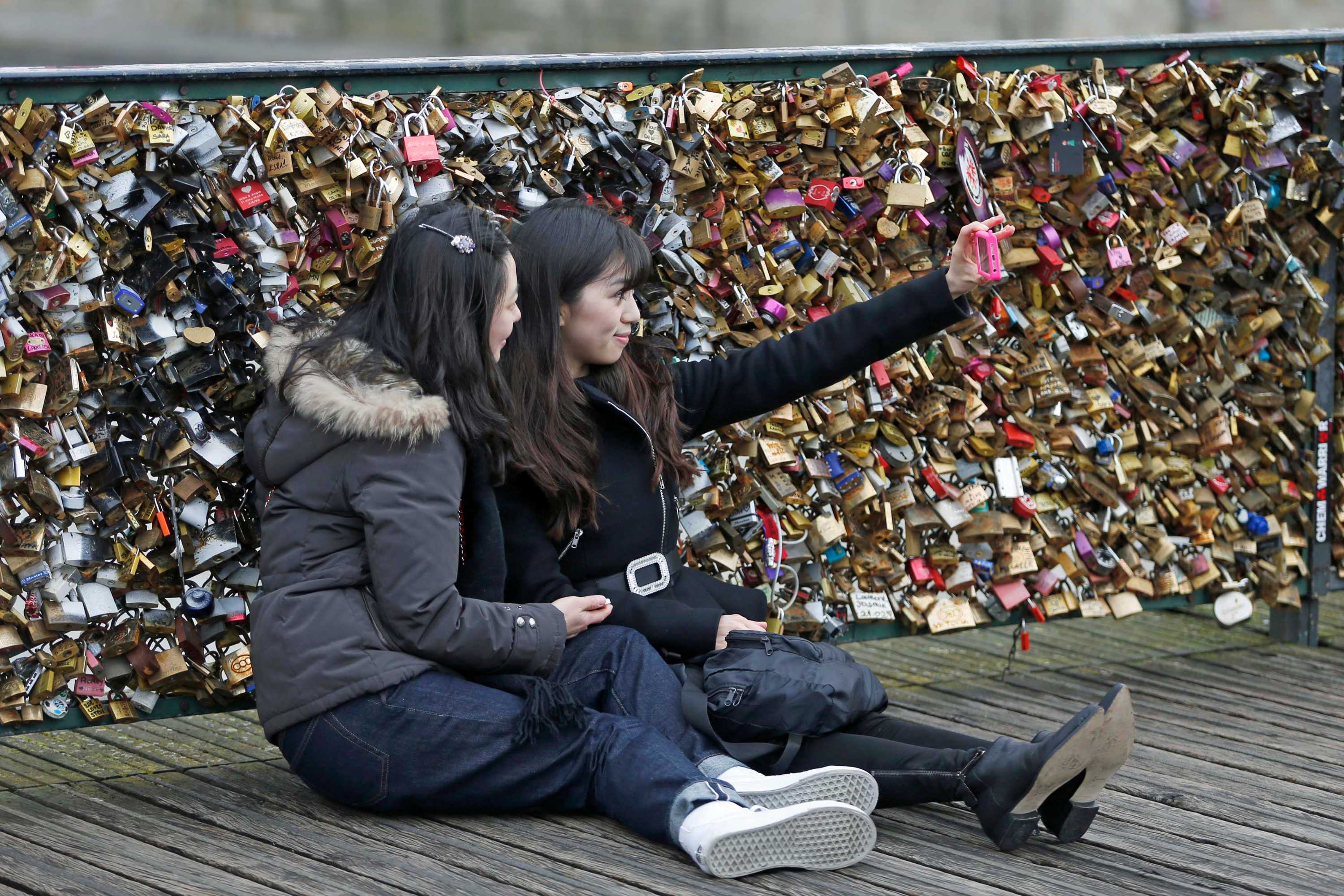 Locks of love bridge in Paris reopens after railing collapse - ABC News