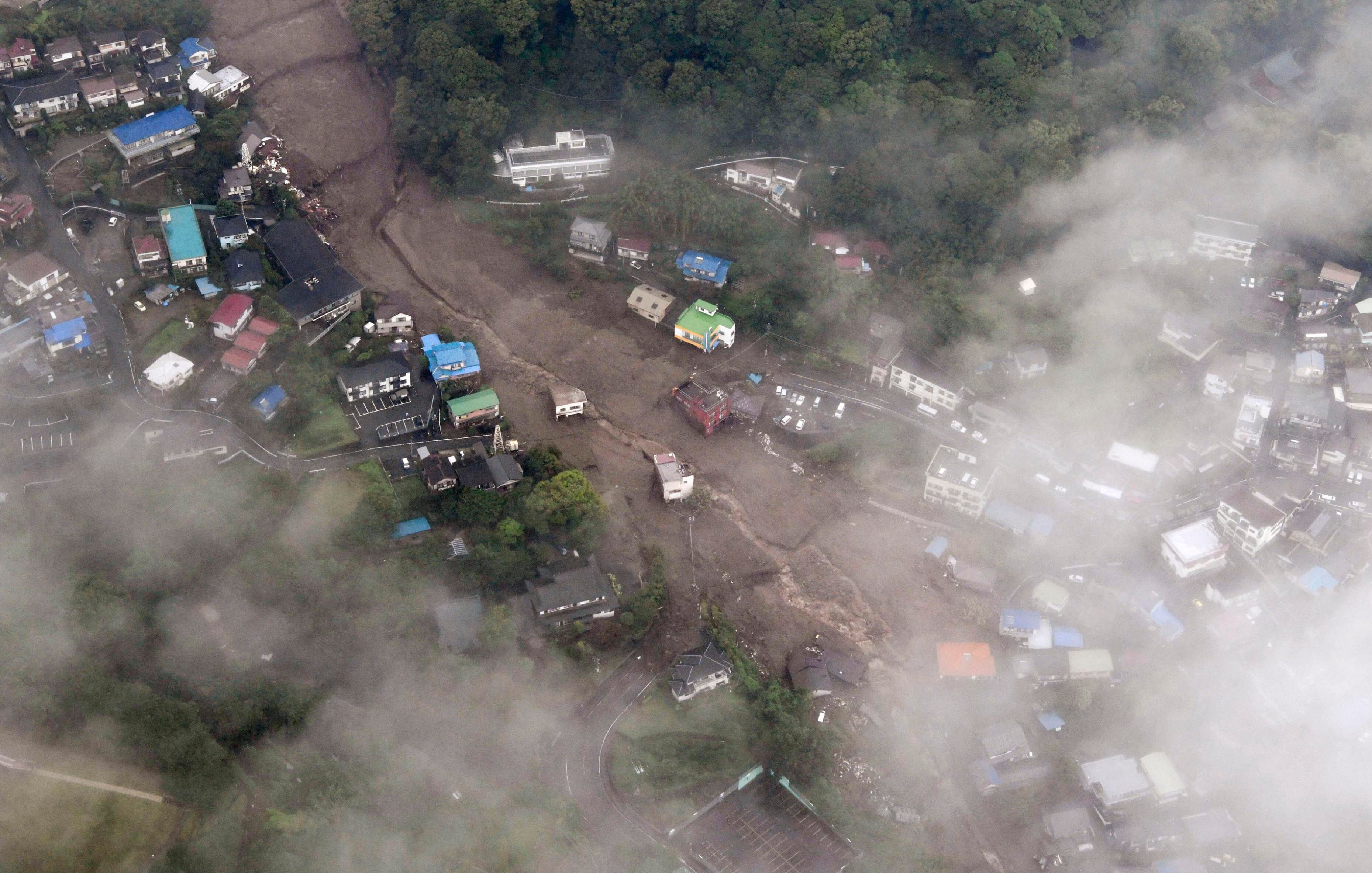 Japanese rescuers find two bodies, continue search for 20 more after ...