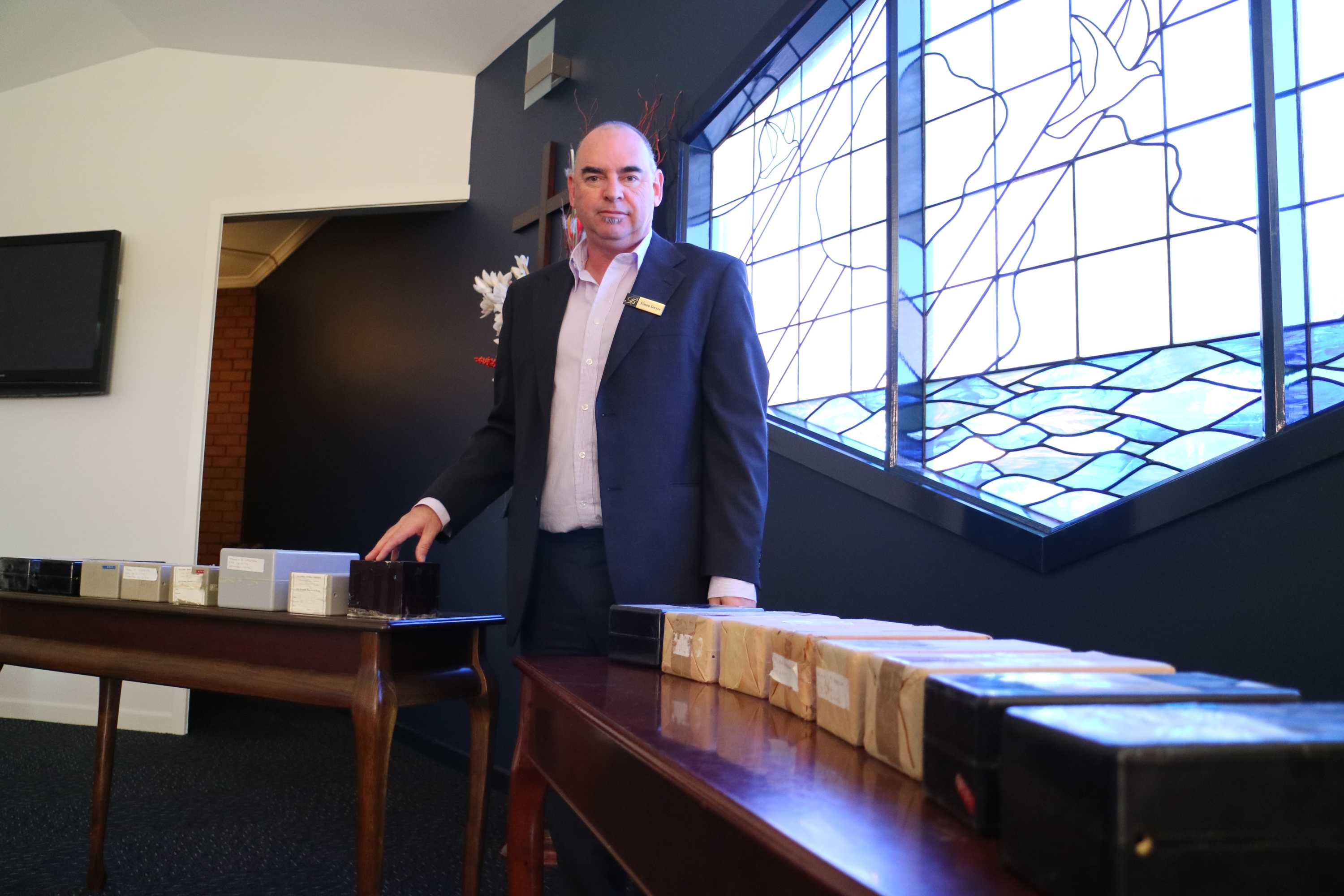 Dozens of forgotten souls' ashes laid to rest after 'sitting on the ...