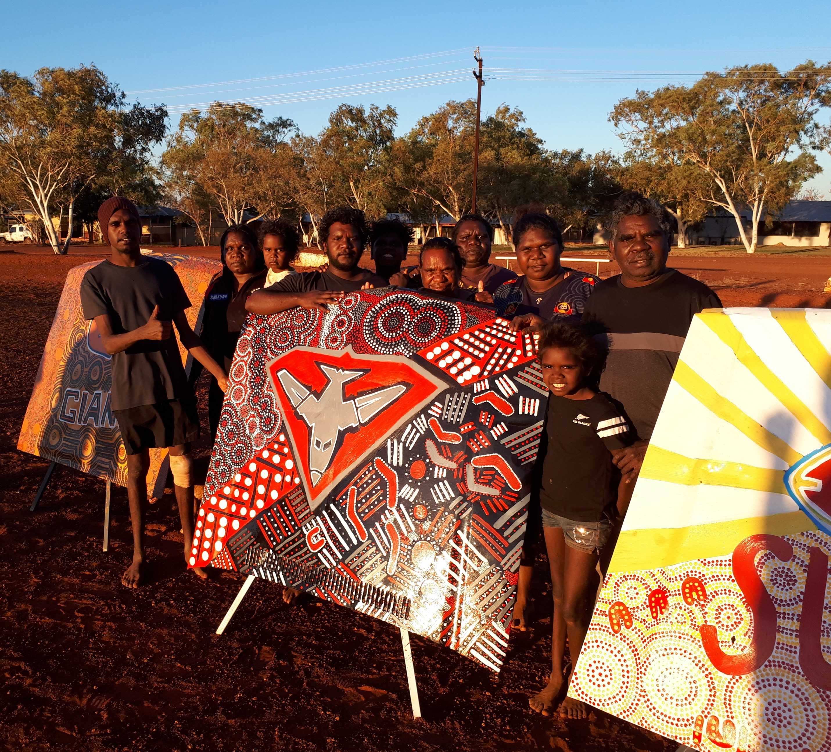 Balgo's remote artists hope footy-themed bonnet art can transform ...