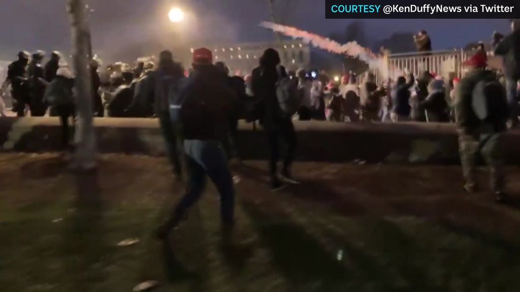 Police appear to be using flash-bang devices to push protesters back ...