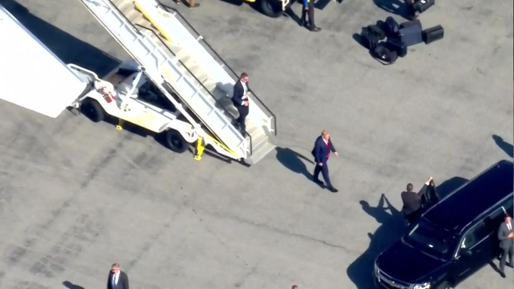 The moment Donald Trump steps off his plane in New York City for his ...