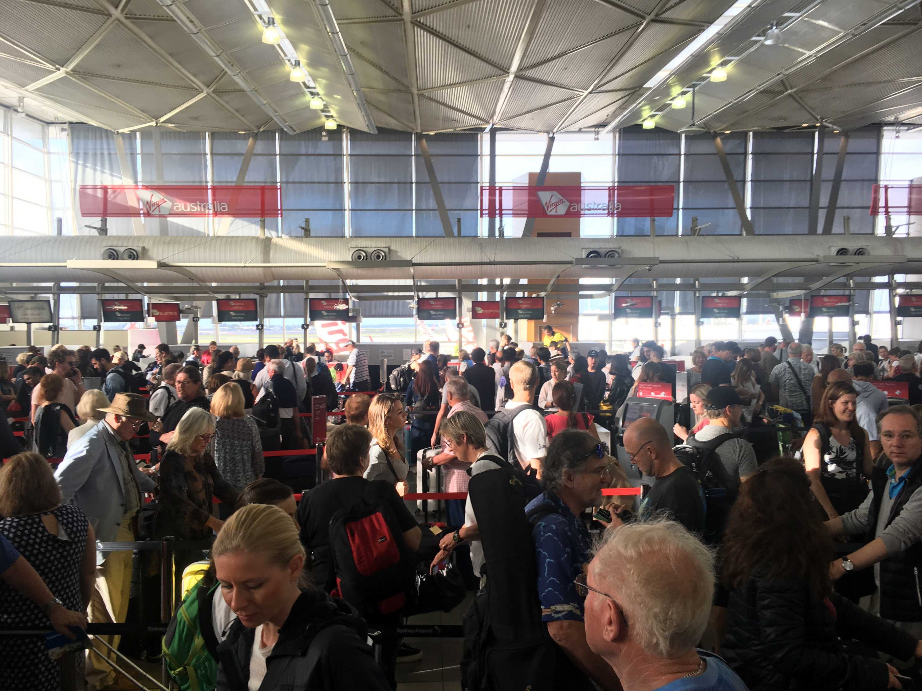 Sydney Airport delays as computer glitch causes terminal chaos - ABC News