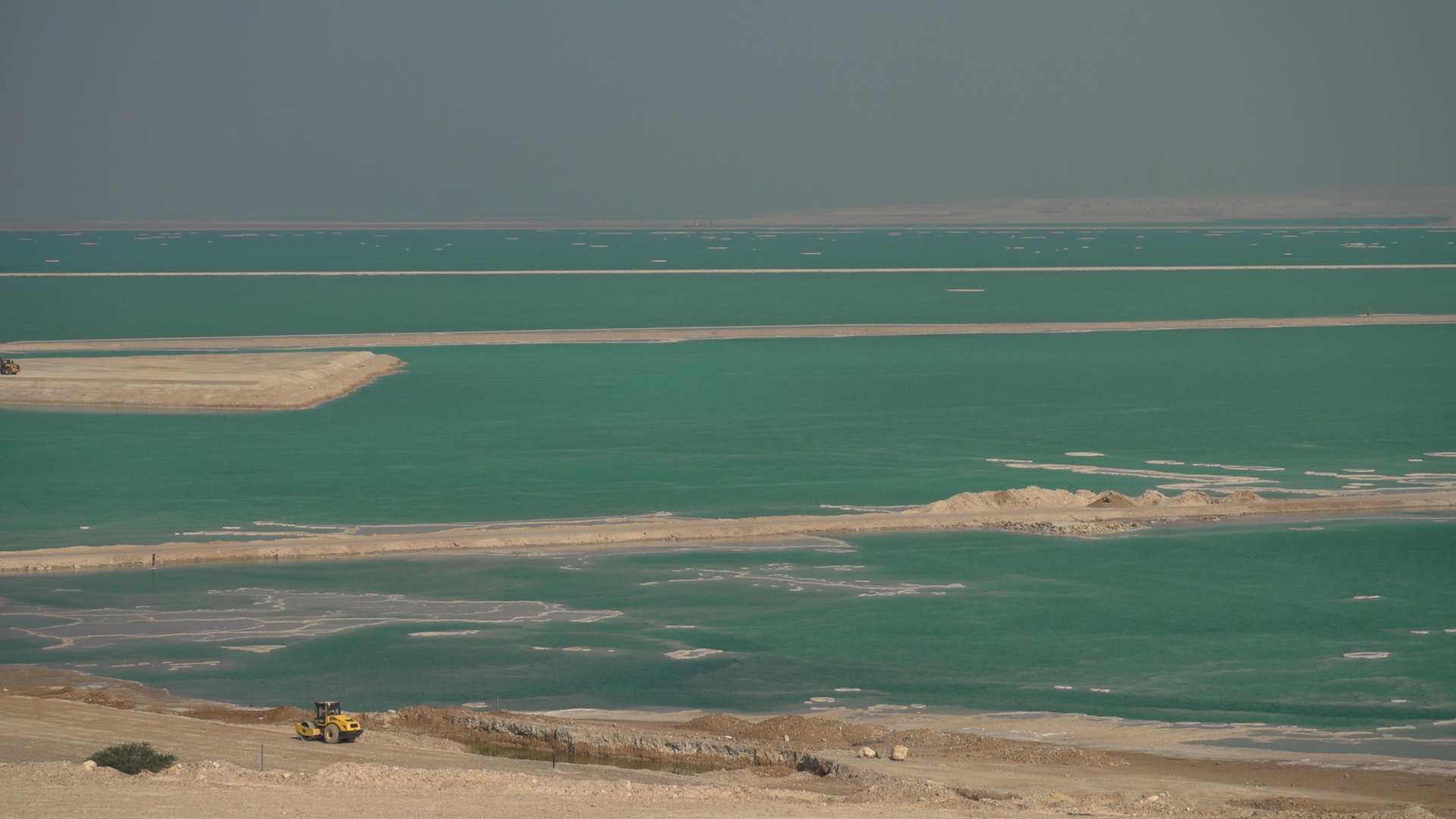 A bulldozer works in the Dead Sea's southern basin - ABC News