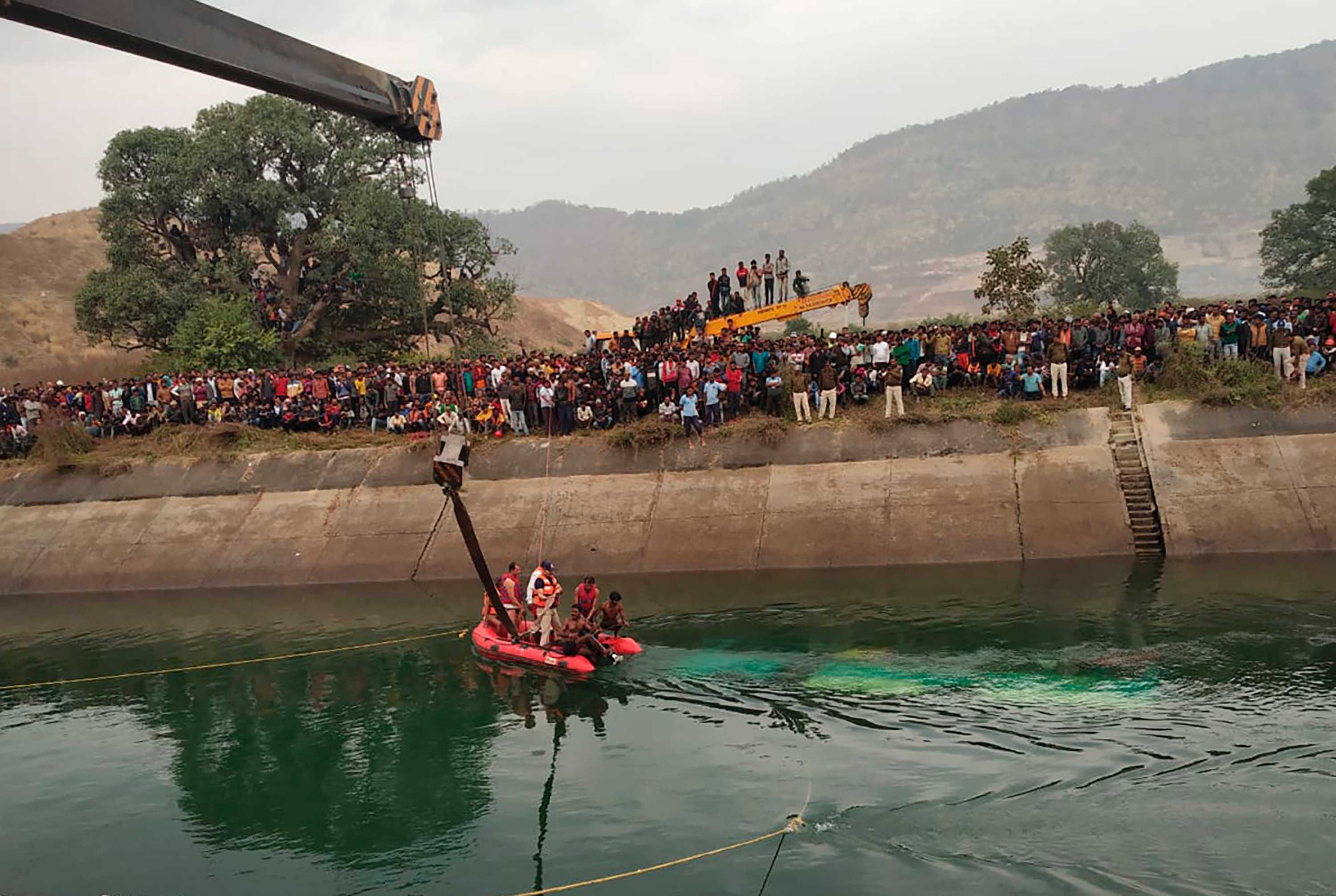 Bus in India crashes through bridge and into canal, killing at least 40 ...