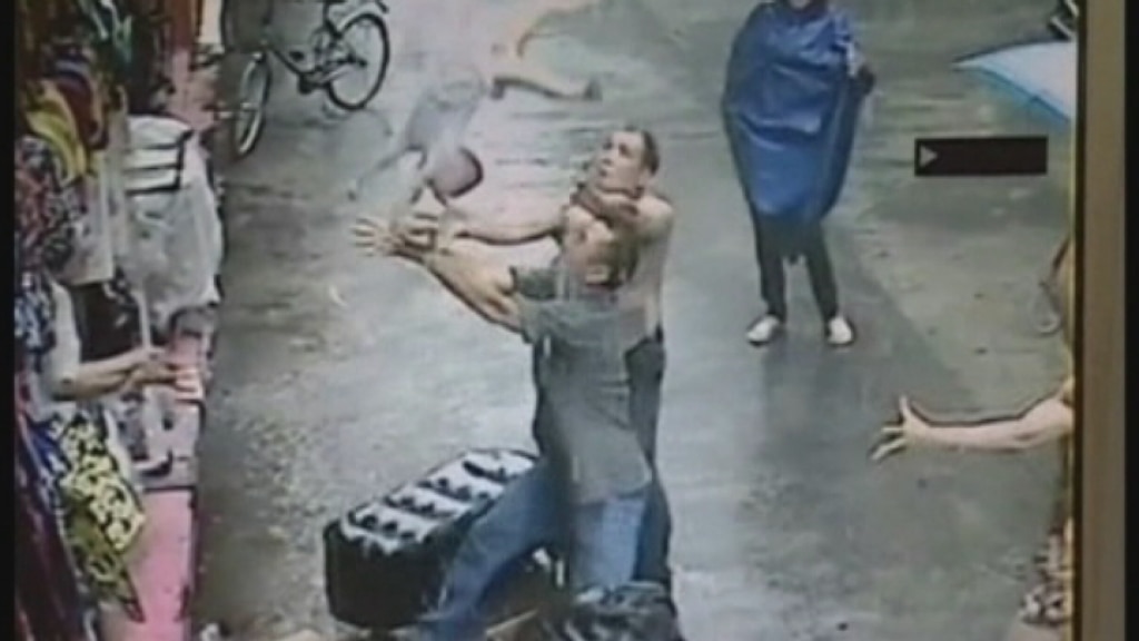 Baby caught by passer-by after falling from building during storm in ...