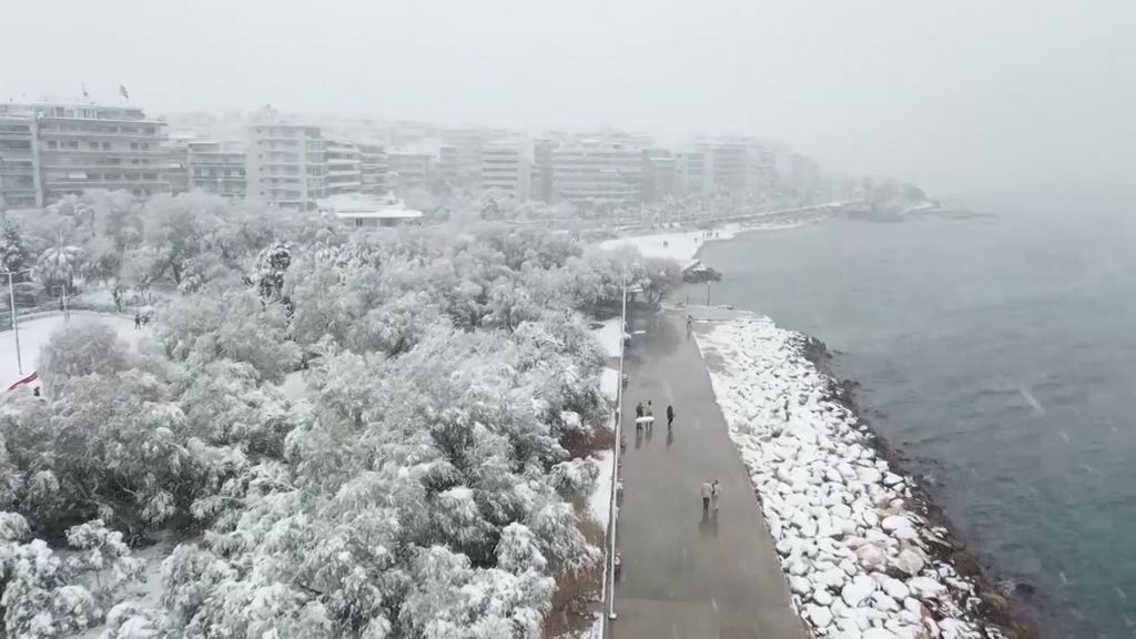 Acropolis, Parthenon and temple of Zeus covered by rare heavy snow as ...