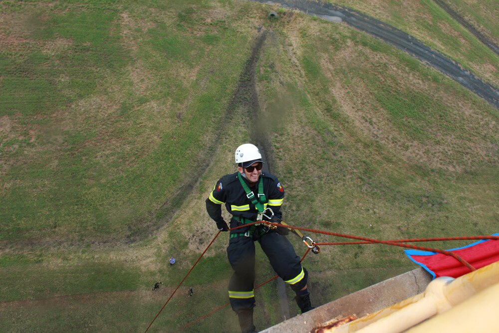 Firefighters step out of the flames and over the ledge for vertical ...