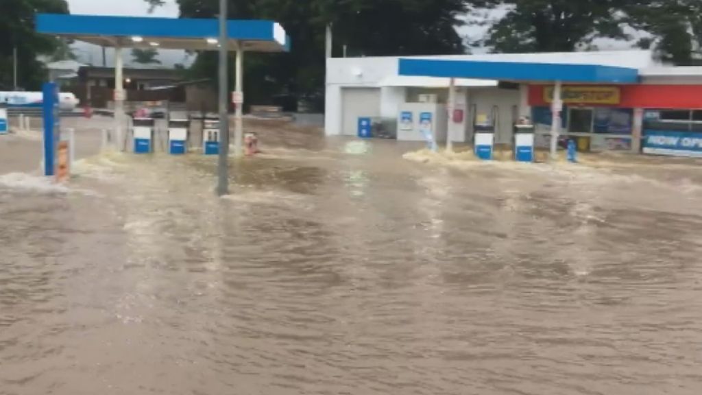 Ingham Flood: Servo smashed by floodwaters - ABC News