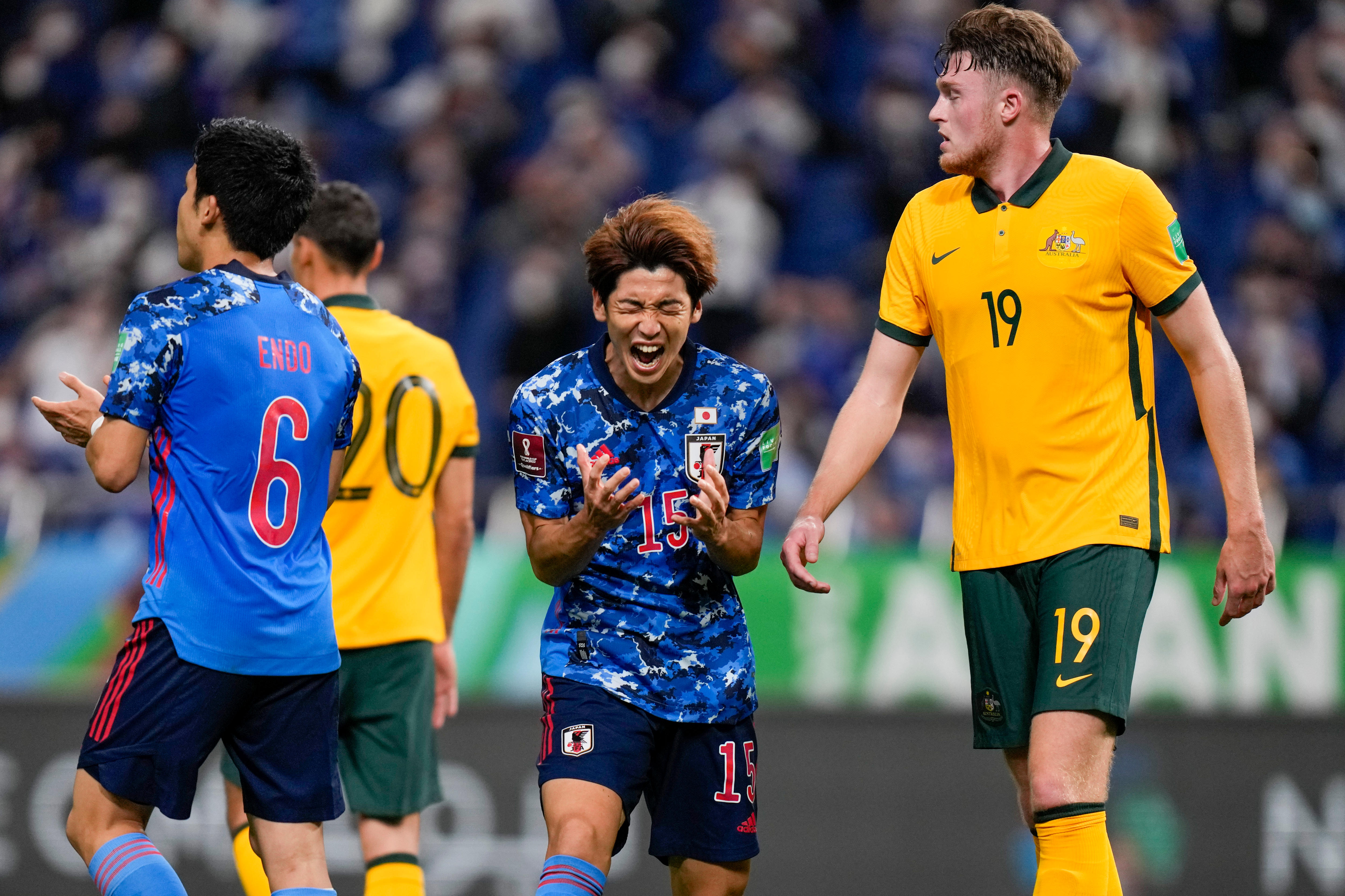 Socceroos' winning run ends as Japan battle to 2-1 victory in Saitama ...