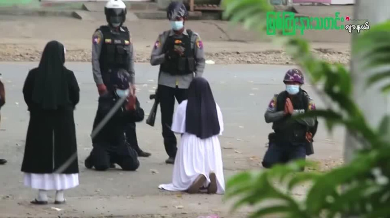 Myanmar nun kneels between police and protesters, pleading for peace ...