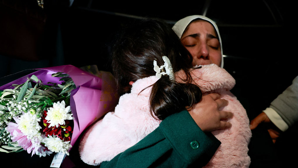 Palestinian detainees speak shortly after being released from an ...