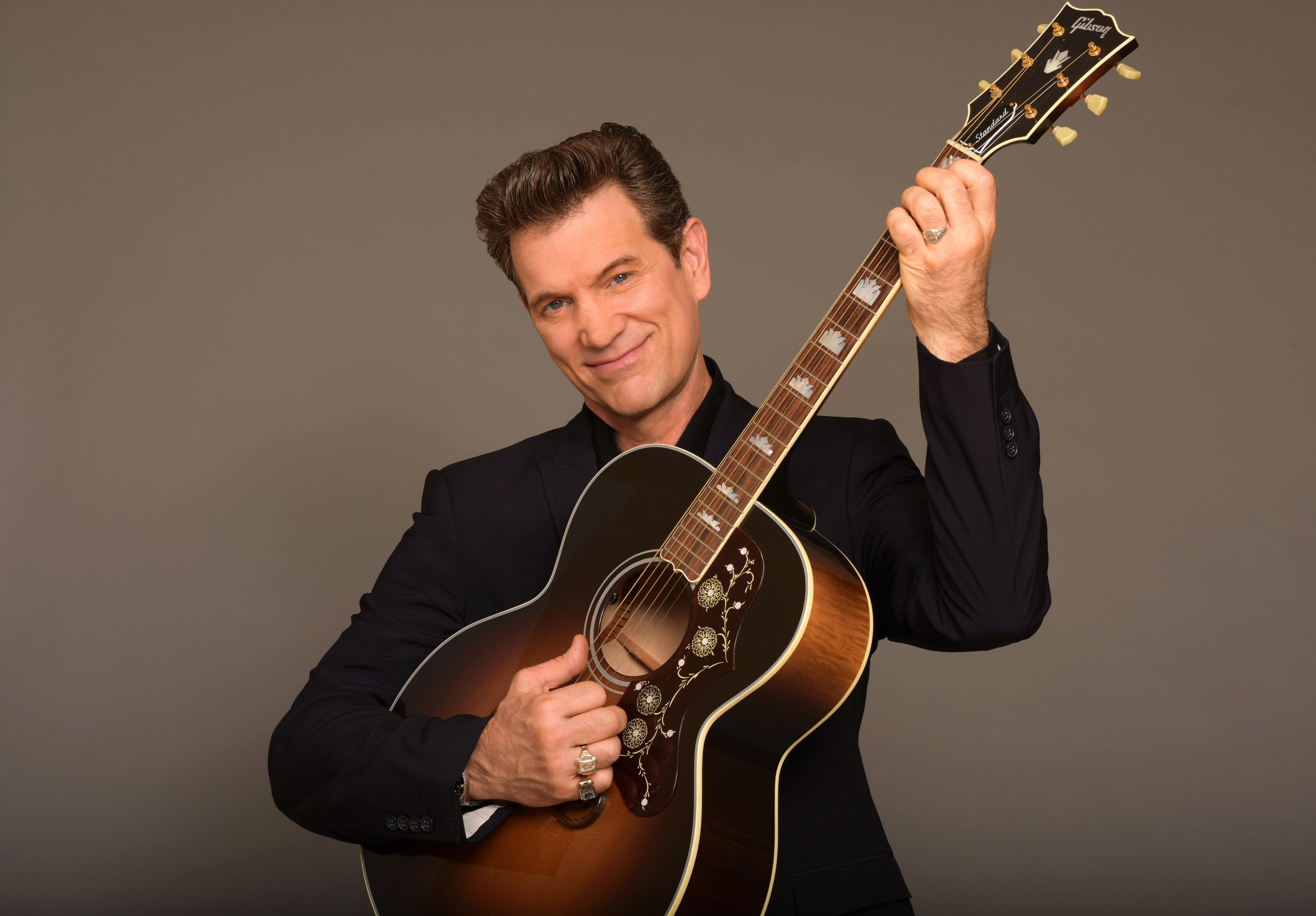 Mirror suits, heaving woolsheds and shirtless surfing. Chris Isaak ...