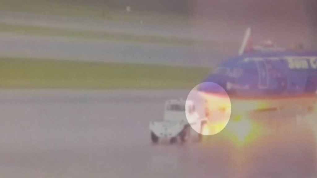 The moment lightning strikes a plane, badly injuring a worker on the ...