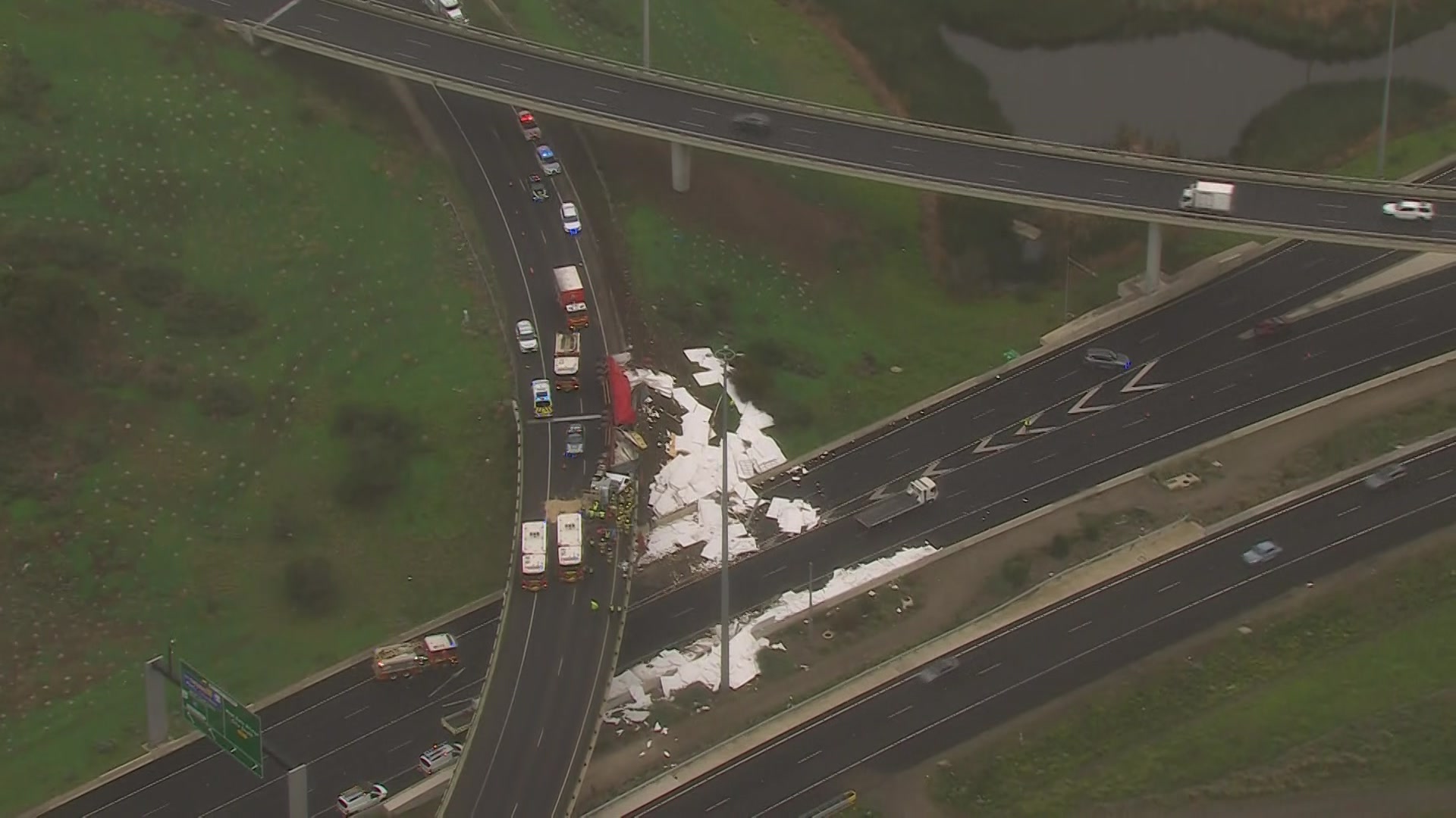 Two drivers injured as truck rollover forces closure of Melbourne's ...