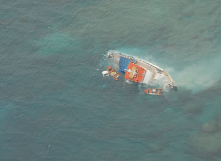 21 rescued after boat capsizes - ABC News