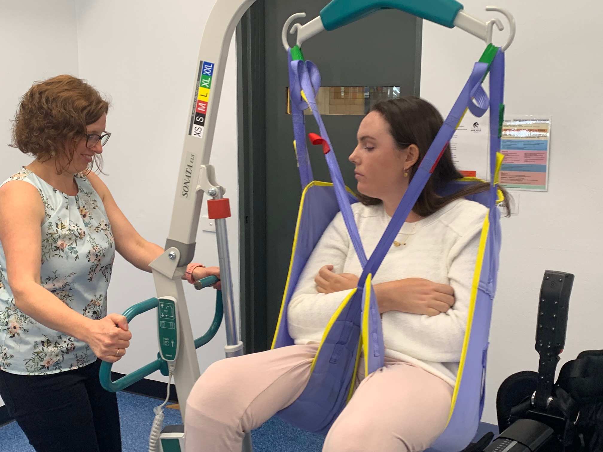 Robotic suit HELLEN helps paralysed surf lifesaver Jess Collins stand ...