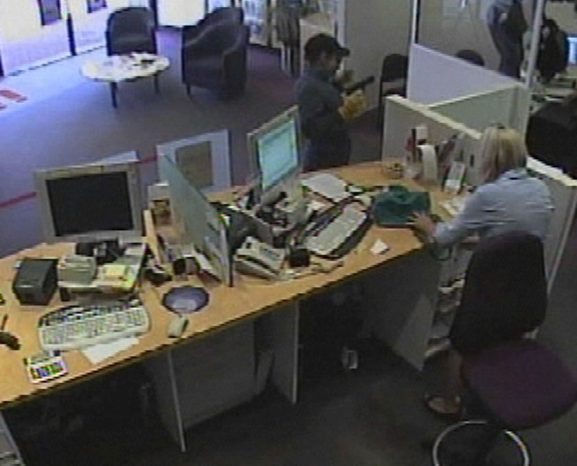 Police release security footage of bank robbery - ABC News