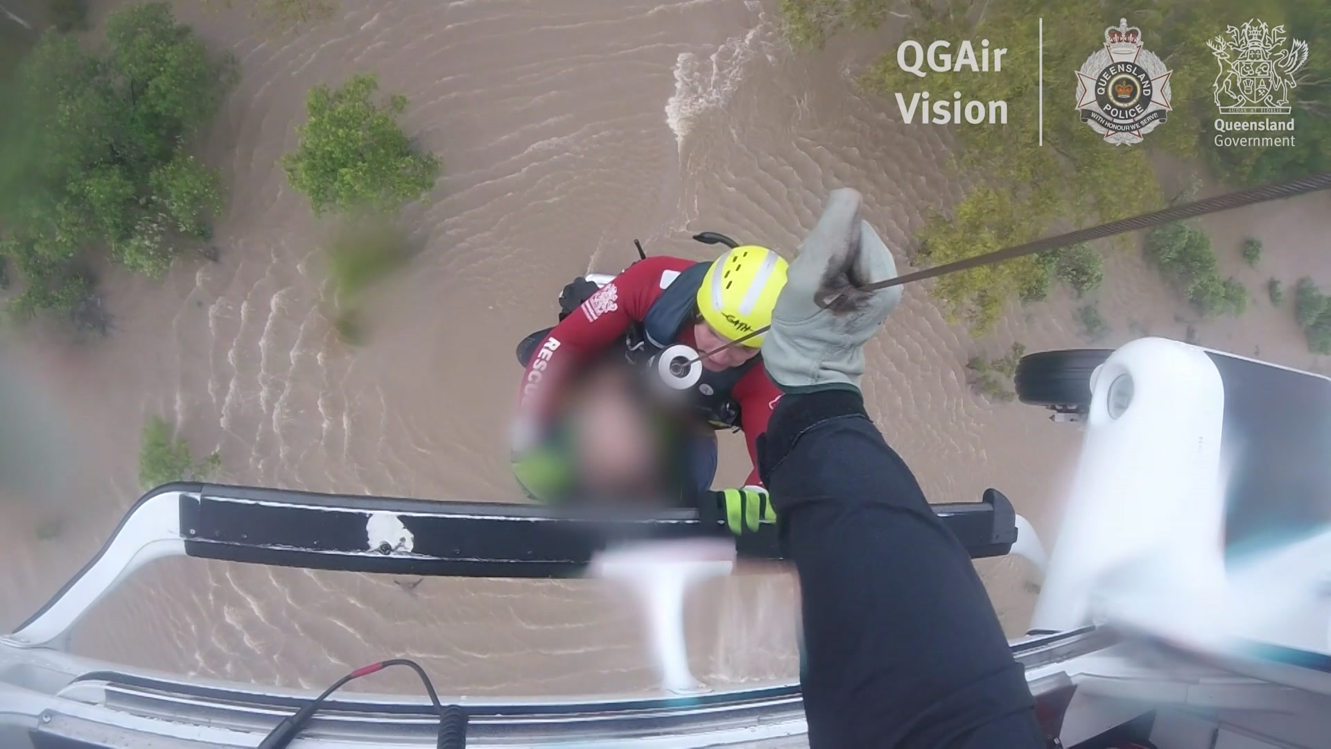 Police vision shows a person being rescued from a submerged car during ...