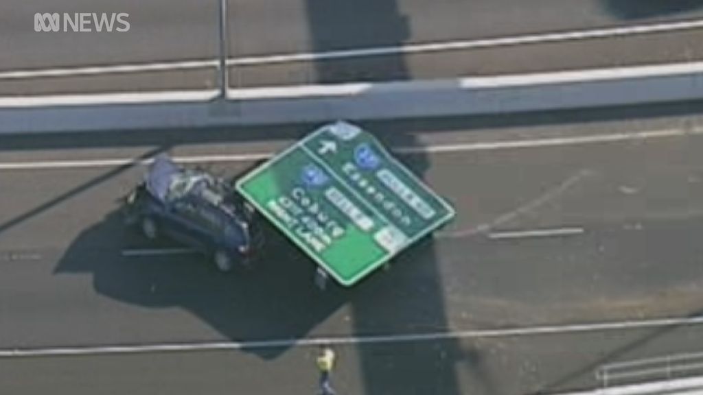 Tullamarine Freeway sign falls and crushes car, injuring Melbourne ...