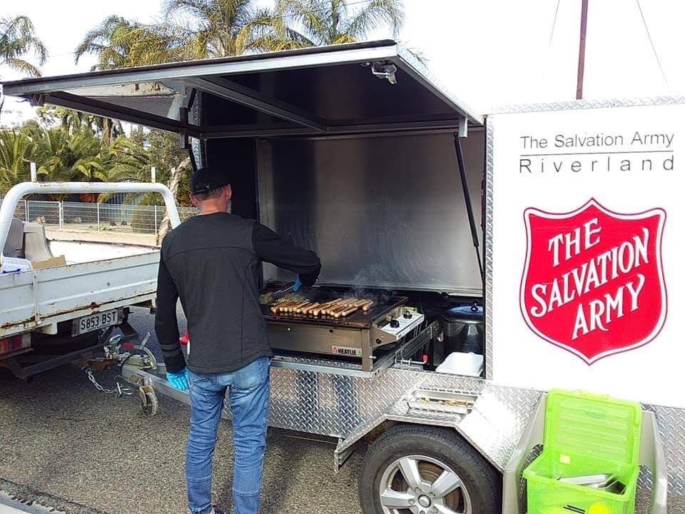 Riverland Salvation Army Corp puts food on the table outside, as ...
