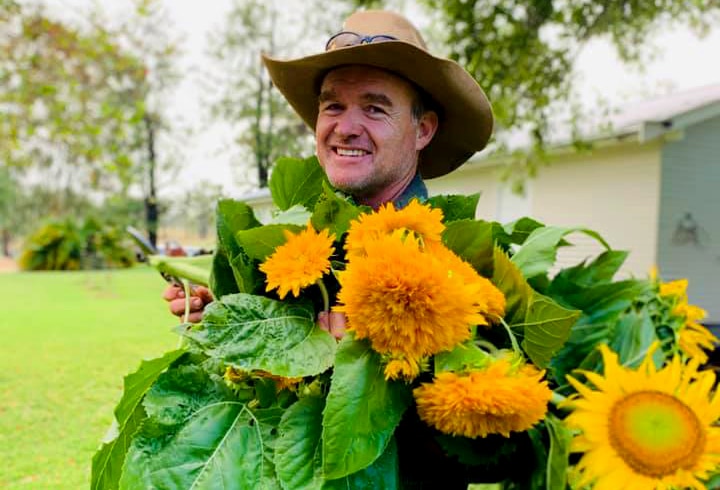 Queensland farmers celebrate blooming good rain — and that's good news ...