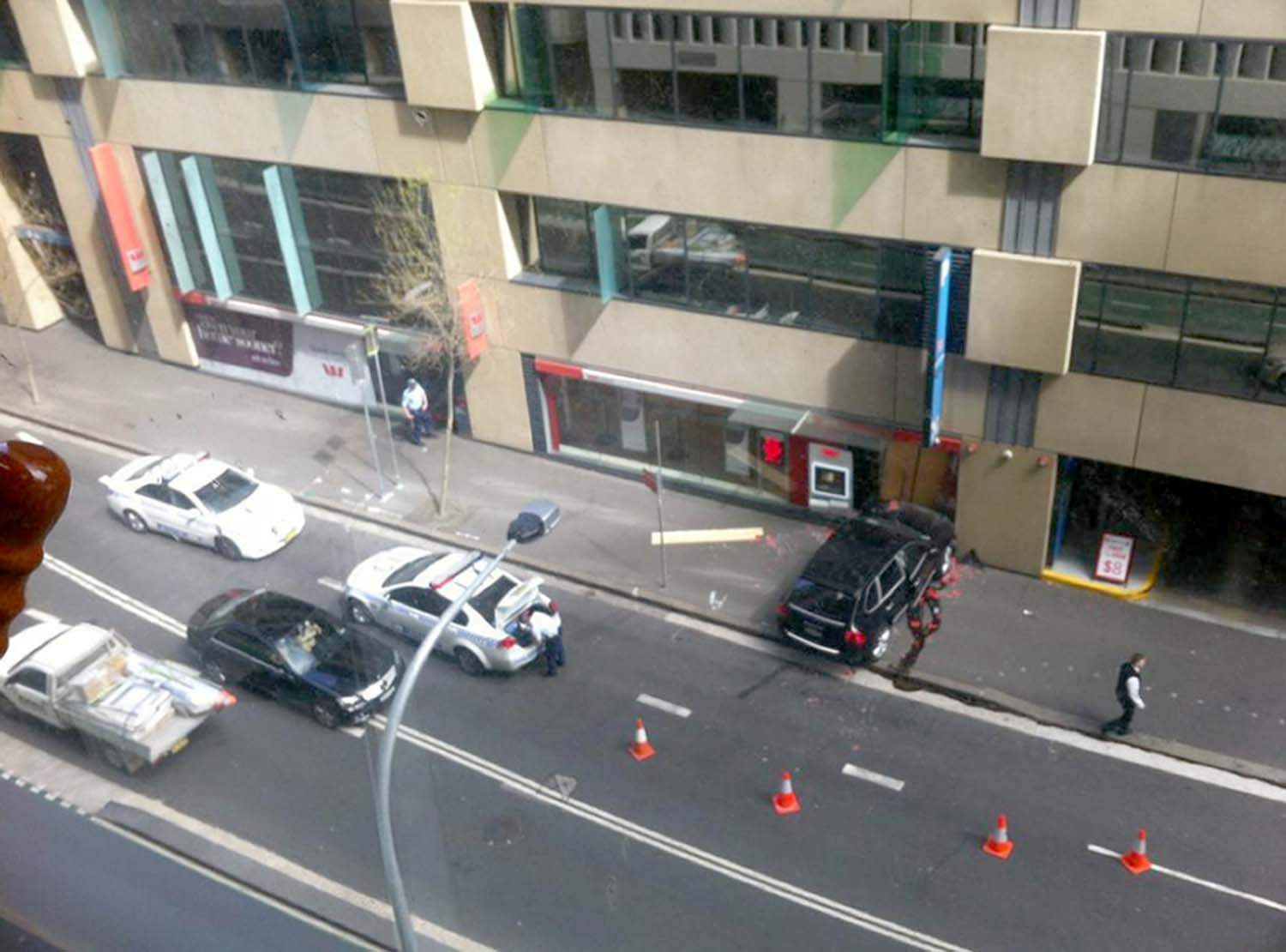 Thieves armed with sledgehammers target Sydney bank in daylight ram ...