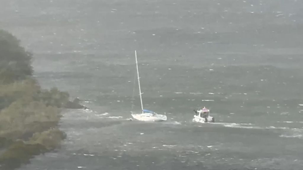 Police recover boats washed away in storm, warn boaters to evacuate ...