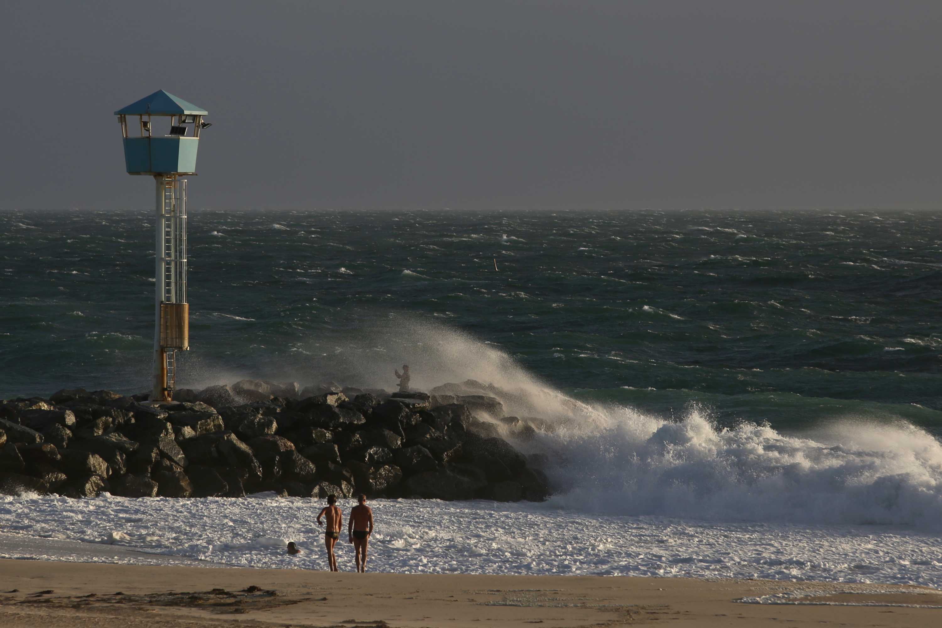 Perth storm hits with force as fierce cold front cuts power to 55,000 ...