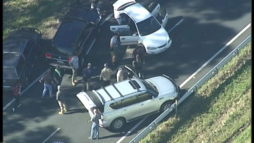 Queensland car jacking ends in police shooting, highway closure - ABC News