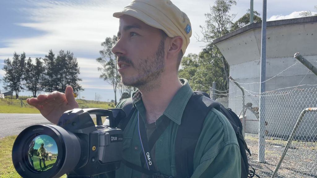 Thermographer sets up the OPI camera for a mine site screening - ABC News