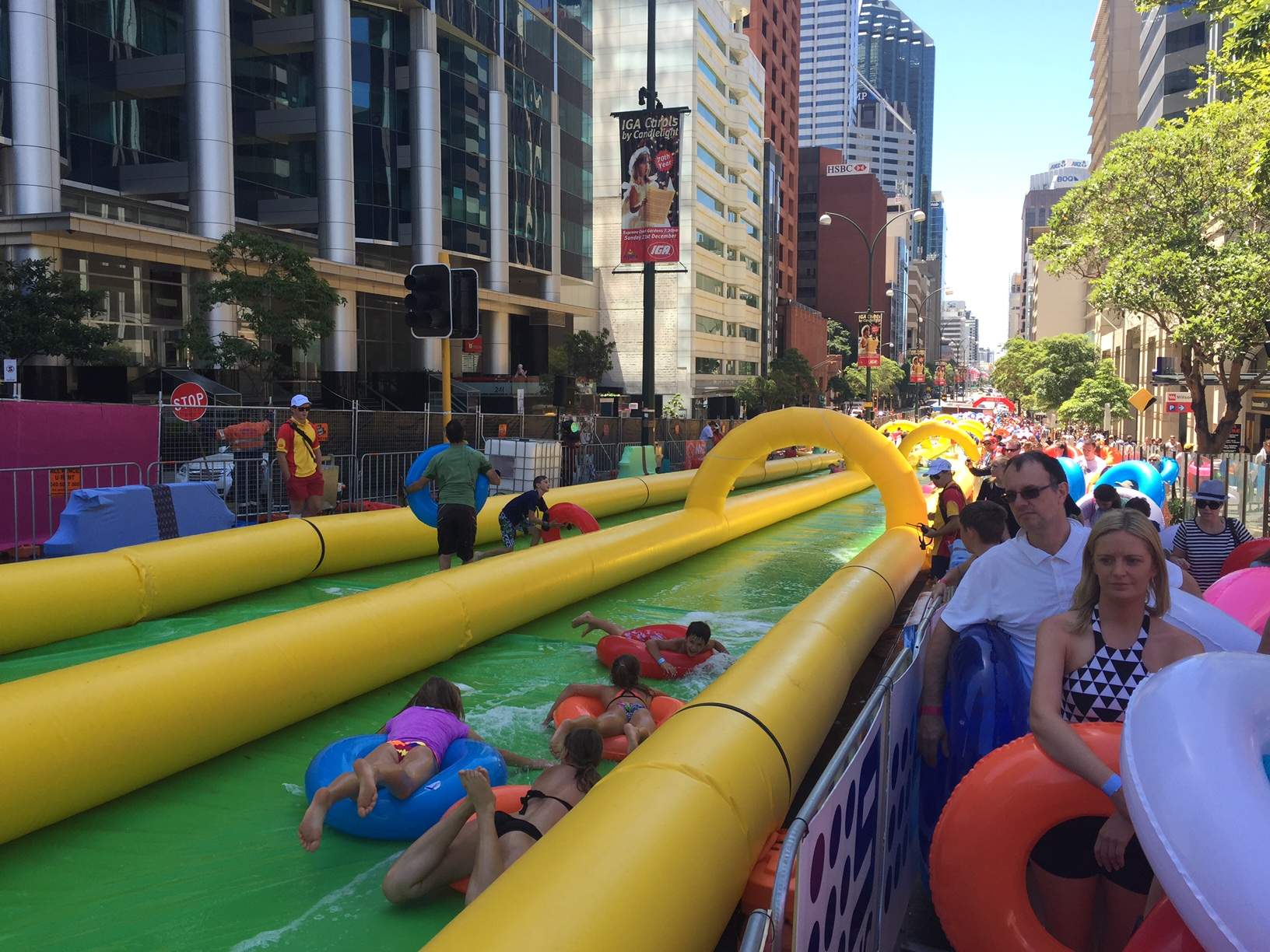 Giant water slide down Perth city street brings crowds - ABC News