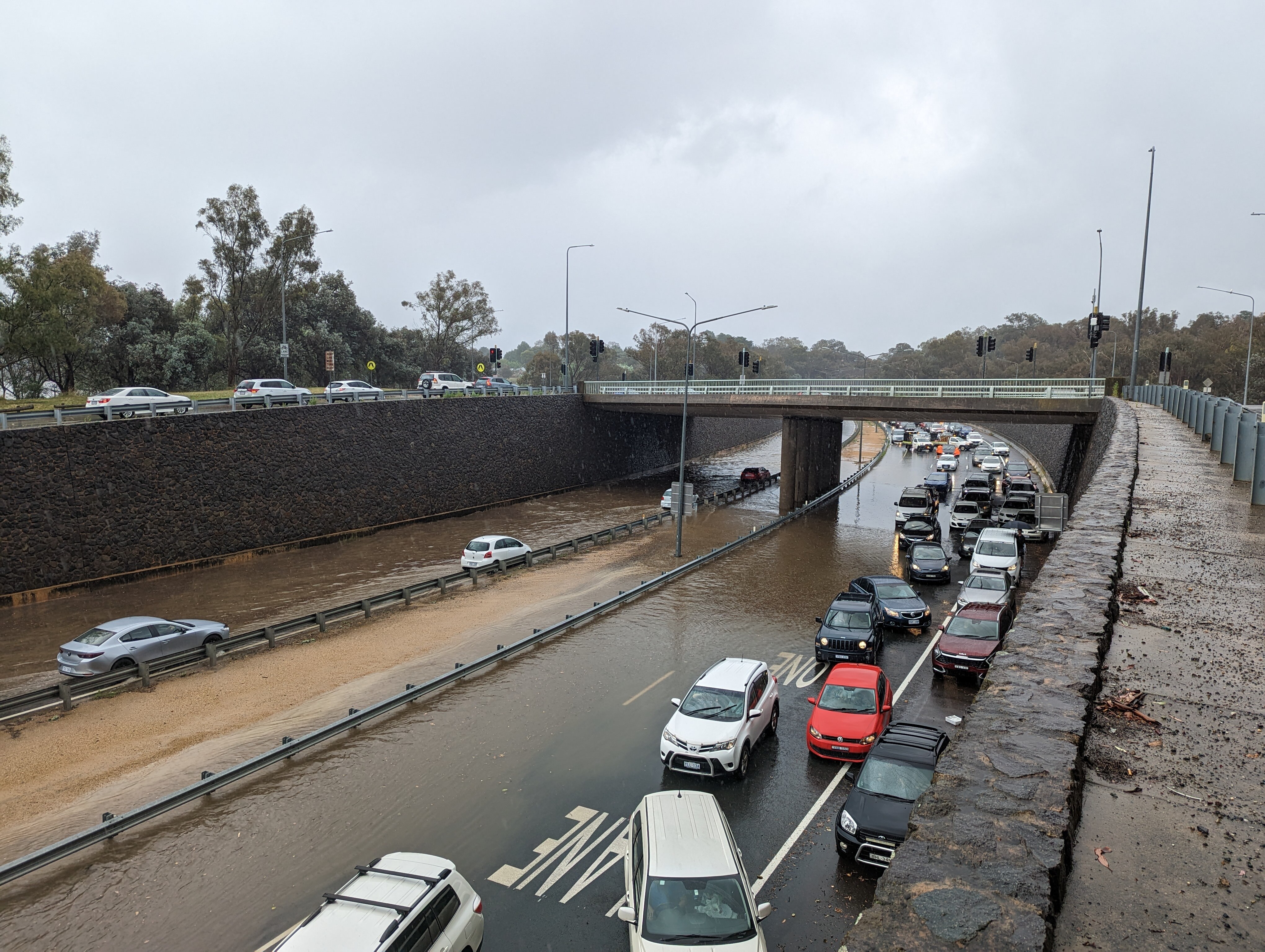 Heavy rainfall causes flash flooding on Canberra's roads, damages homes ...