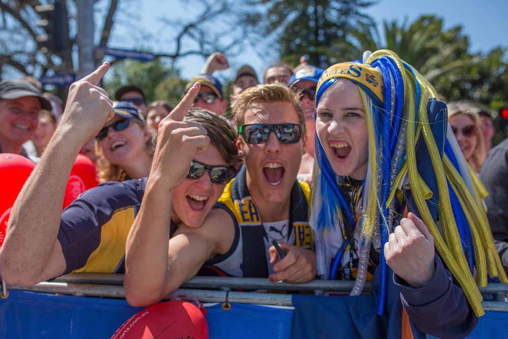 AFL fans line Melbourne streets as debate over public holiday continues ...