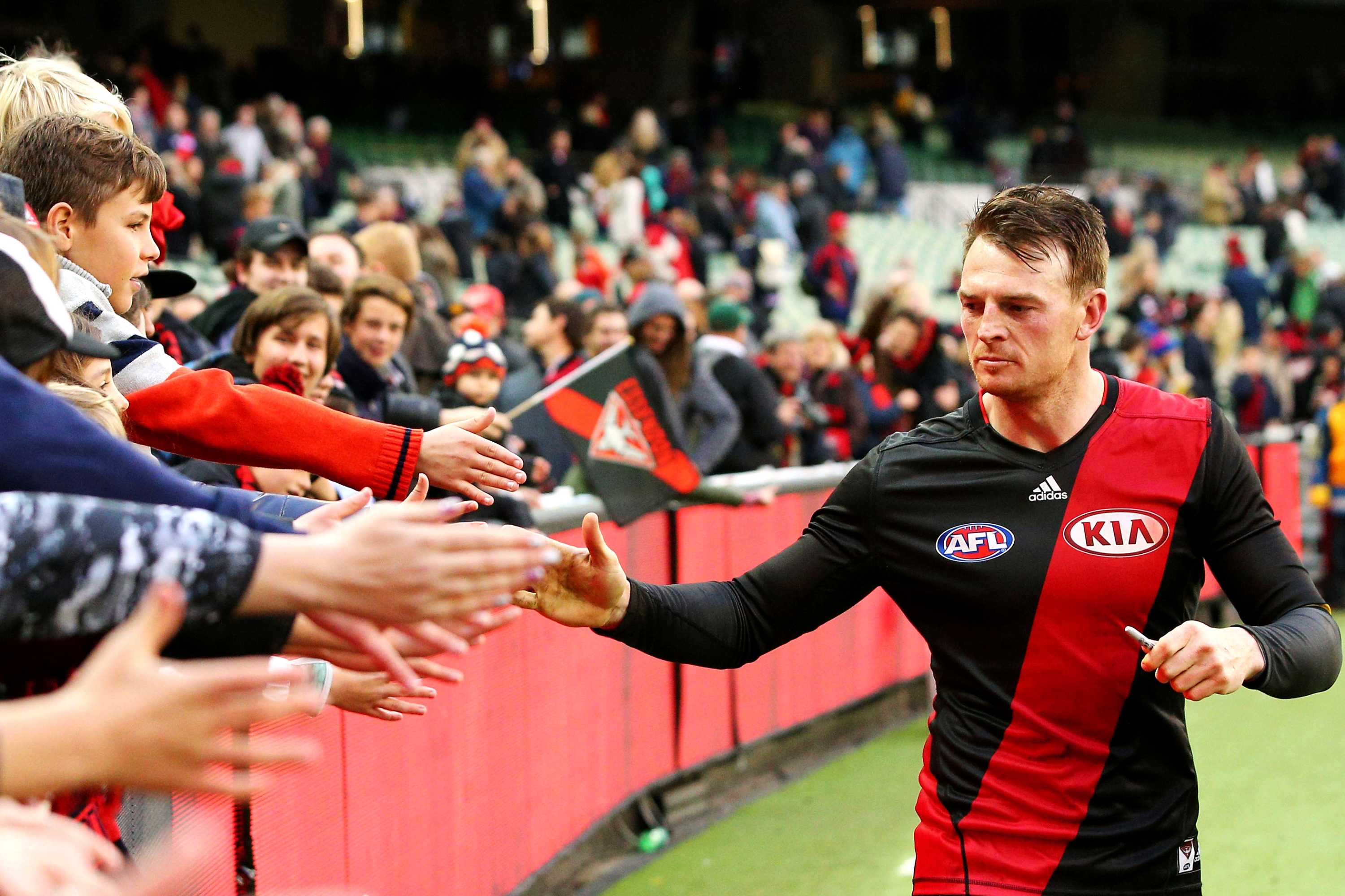 Brendon Goddard and Essendon Football Club's Purple Bombers tackling ...