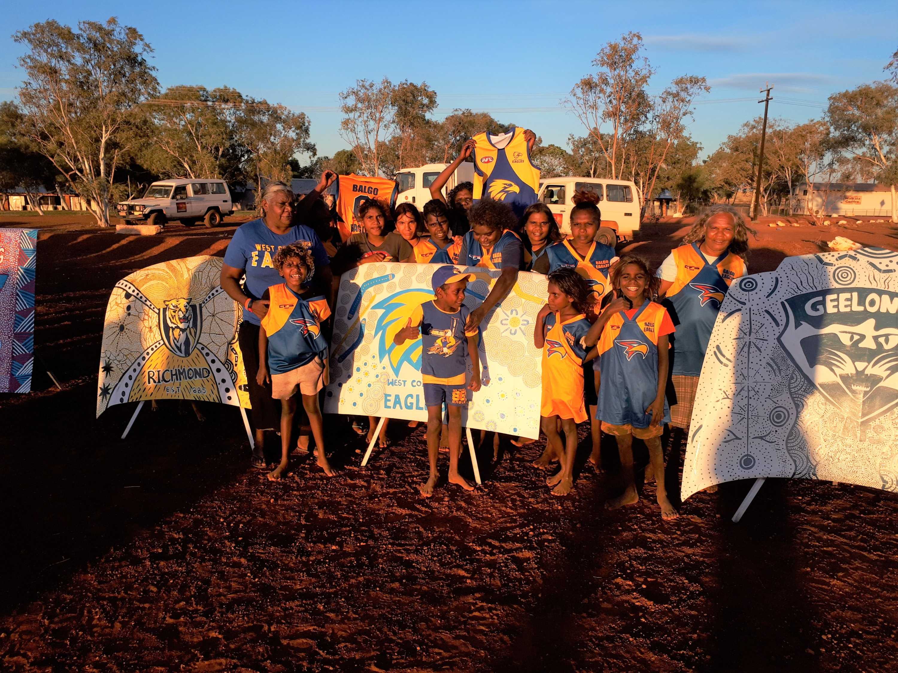 Balgo's remote artists hope footy-themed bonnet art can transform ...
