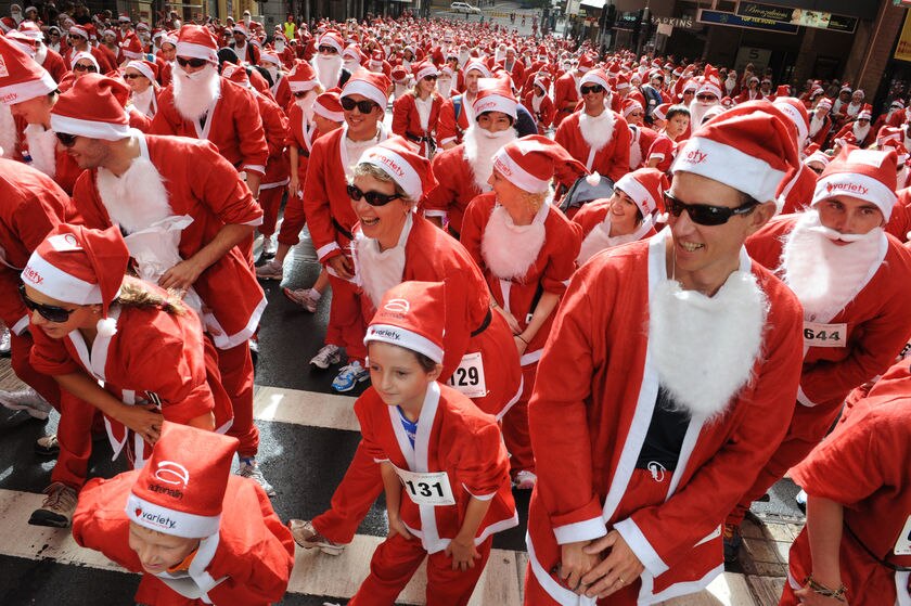 Santas pound pavement for charity - ABC News
