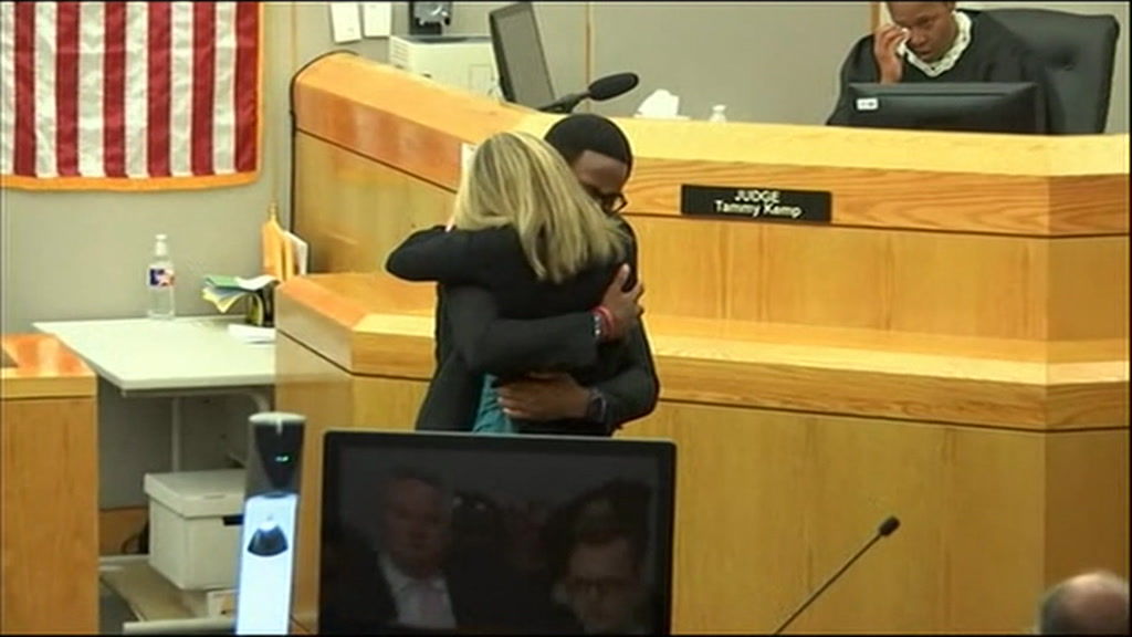 Emotional brother of Botham Jean hugs Guyger in court - ABC News