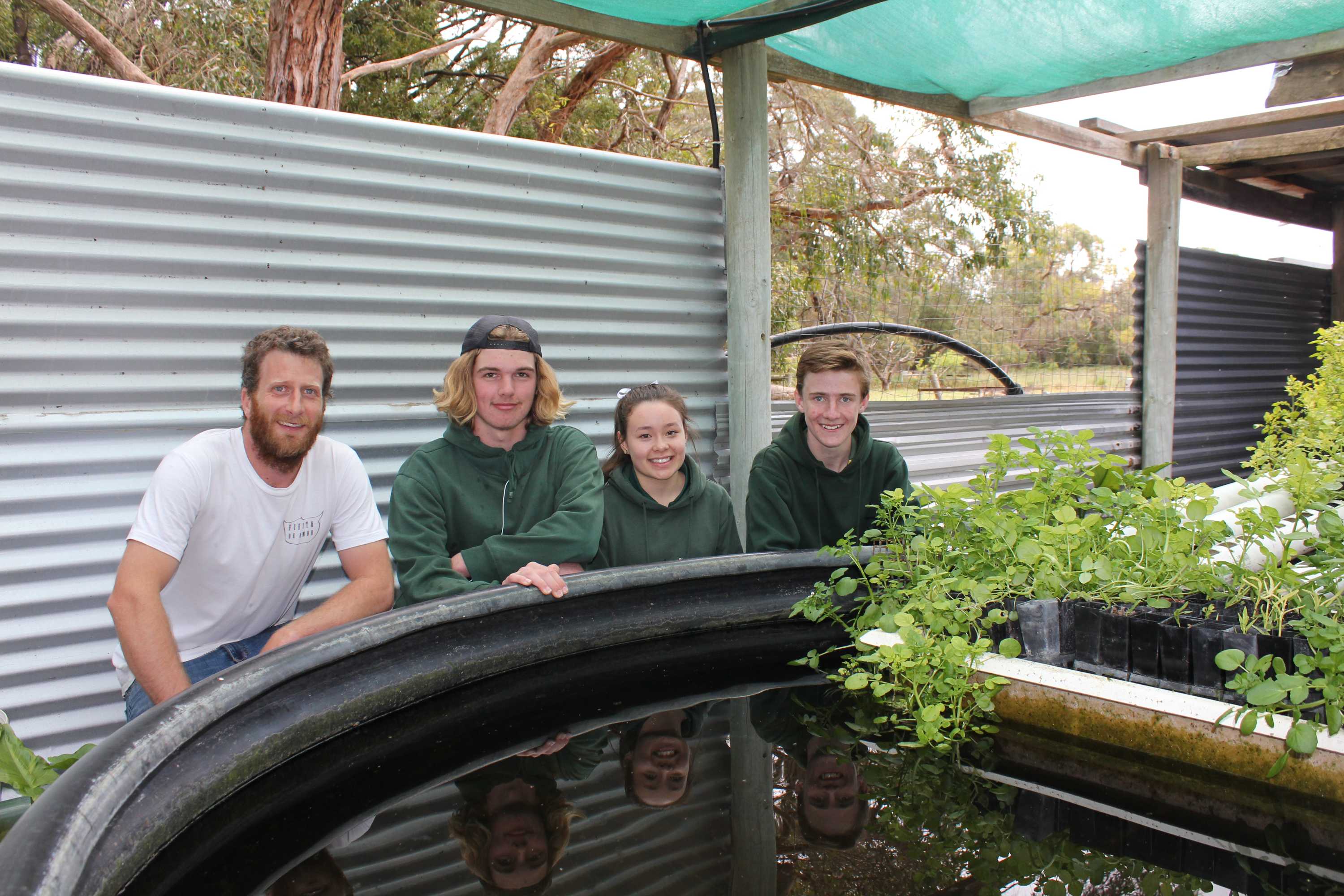 Bush school embraces solar power as students build panels for fish farm ...