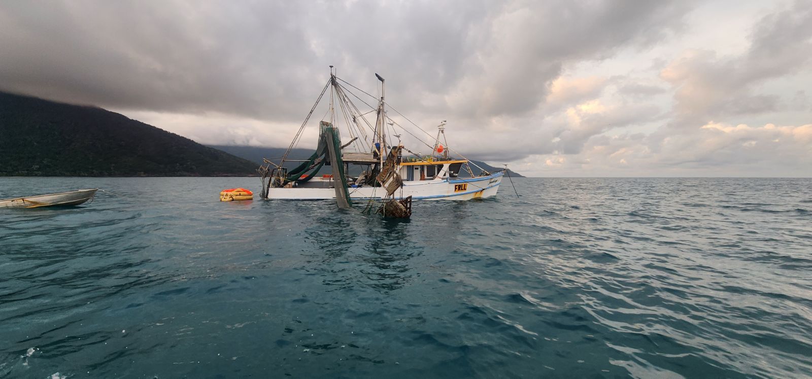 Prawn trawler crew rescued from sinking boat off Far North Queensland ...