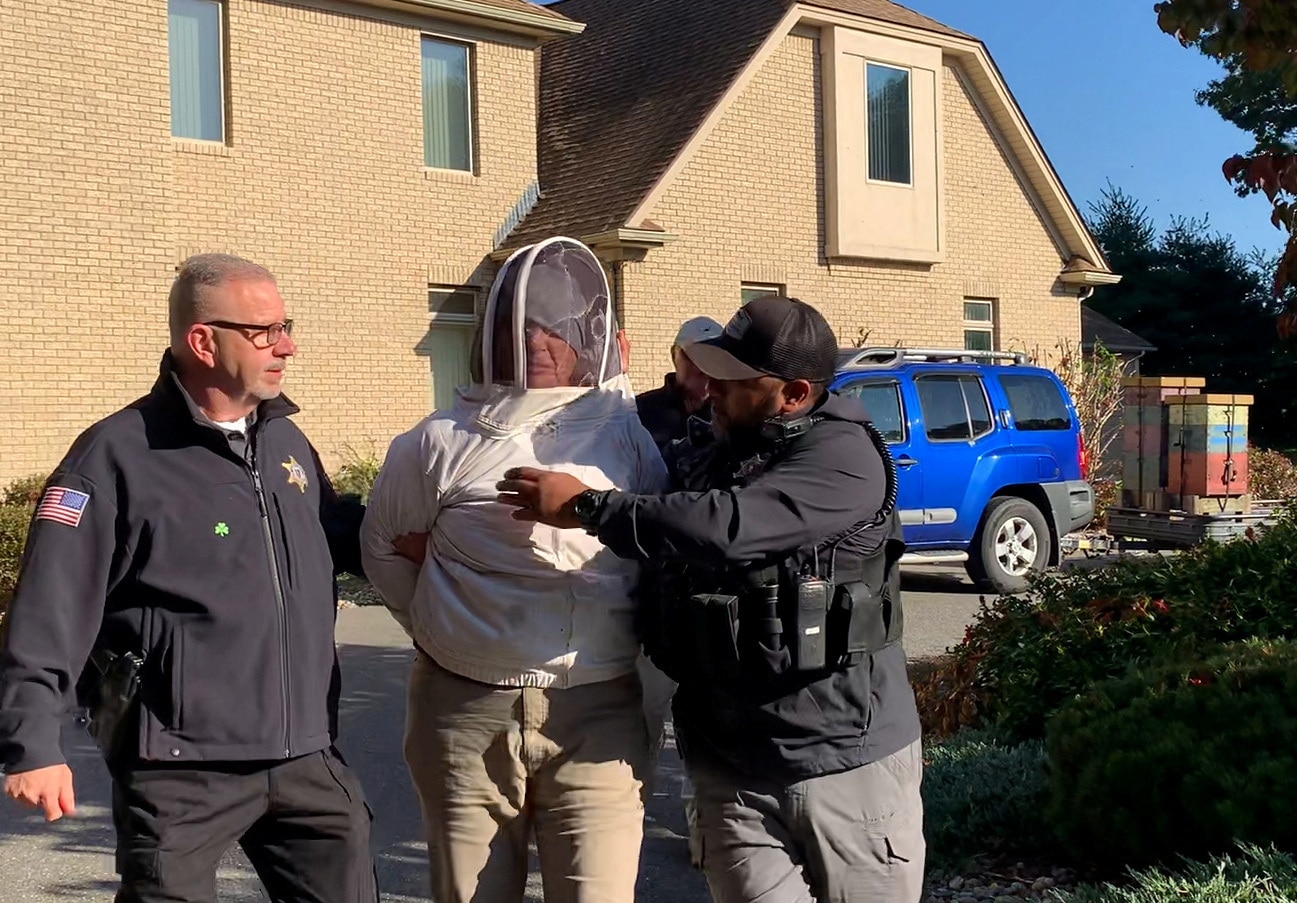 US woman unleashes hive of bees on police officers during eviction of ...