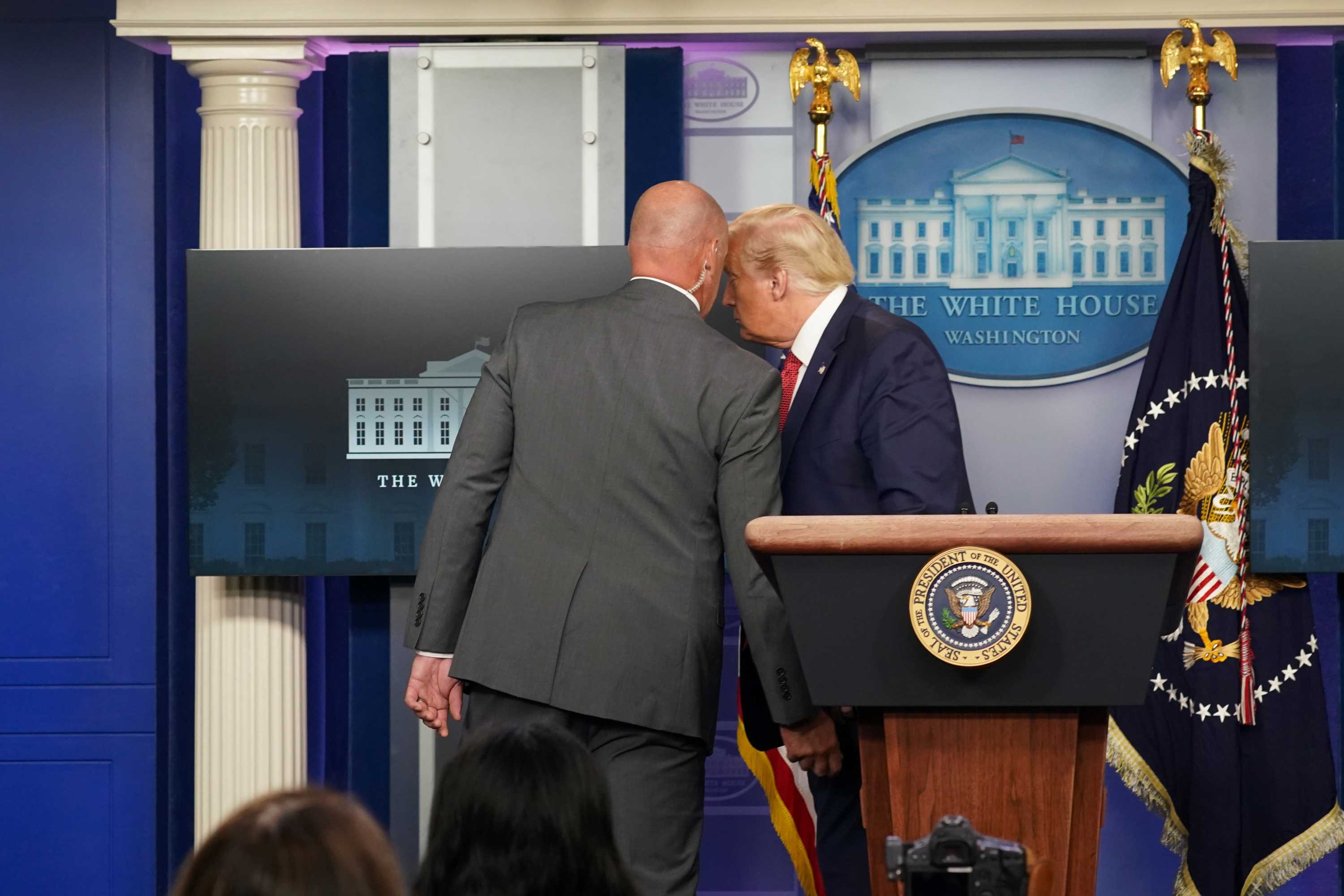 Donald Trump escorted from press conference by Secret Service after ...